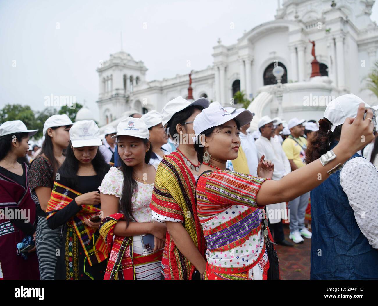 Indigenous people are walking with traditional folk dresses during a ...