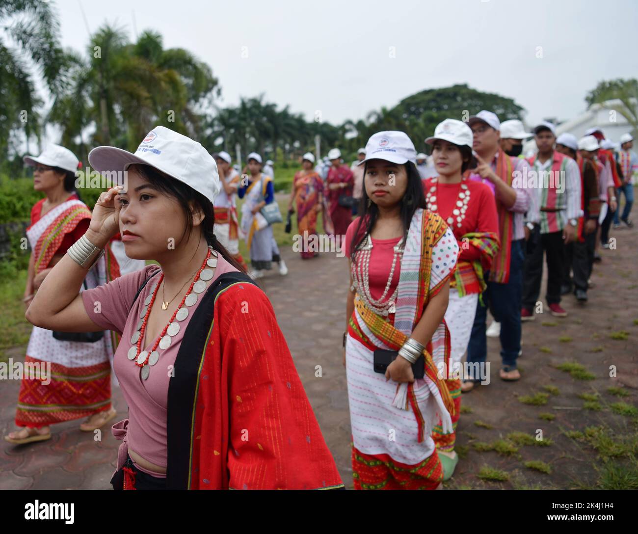 Indigenous people are walking with traditional folk dresses during a ...