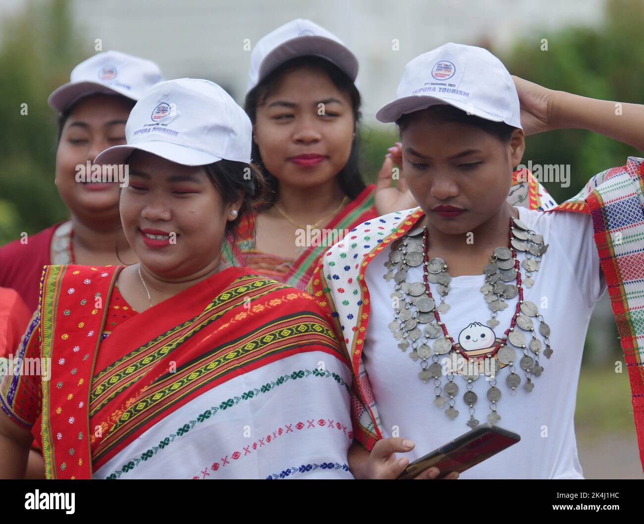 Indigenous people are walking with traditional folk dresses during a ...