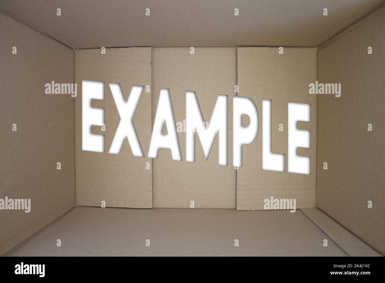 Example word with cardboard box. Brown folded card box Stock Photo - Alamy