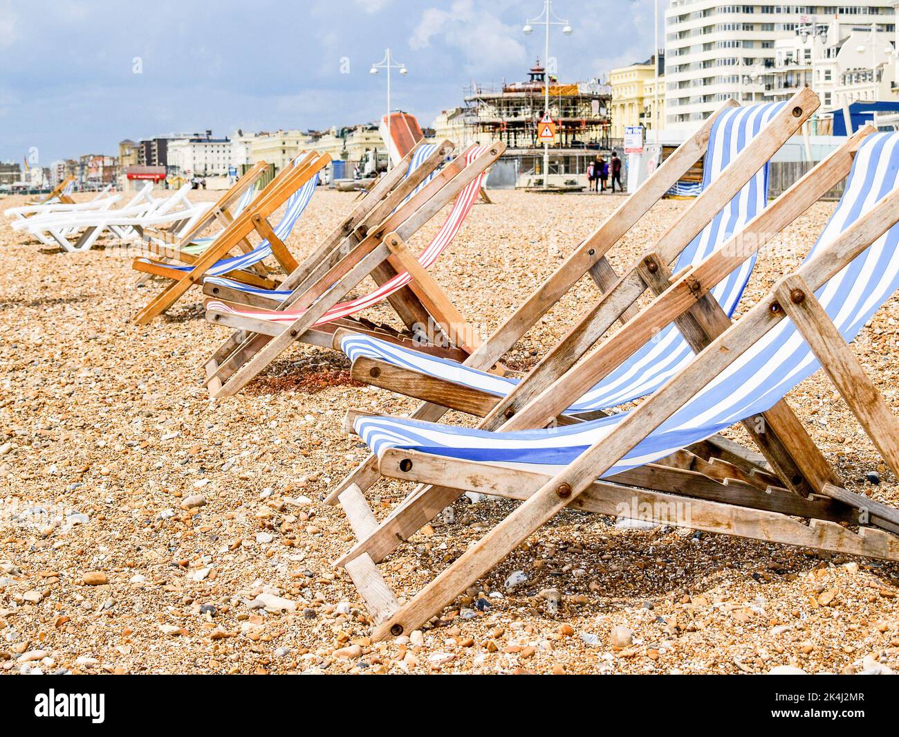 Brighton Beach and characteristic striped beach chairs in blue or red ...