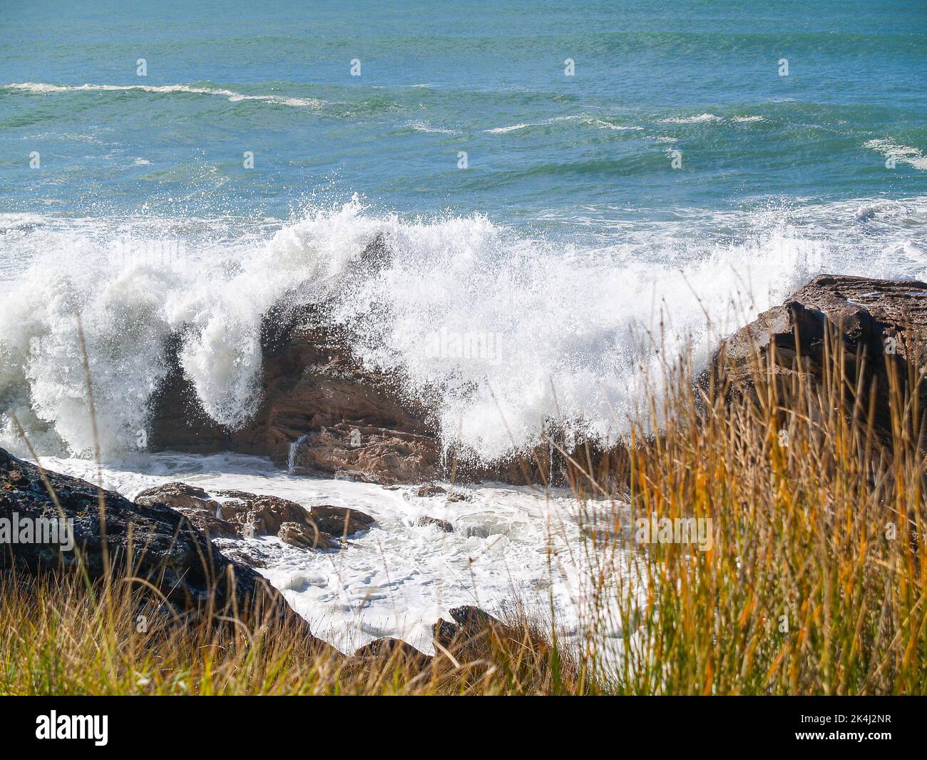 Wave breaking over around hi-res stock photography and images - Alamy