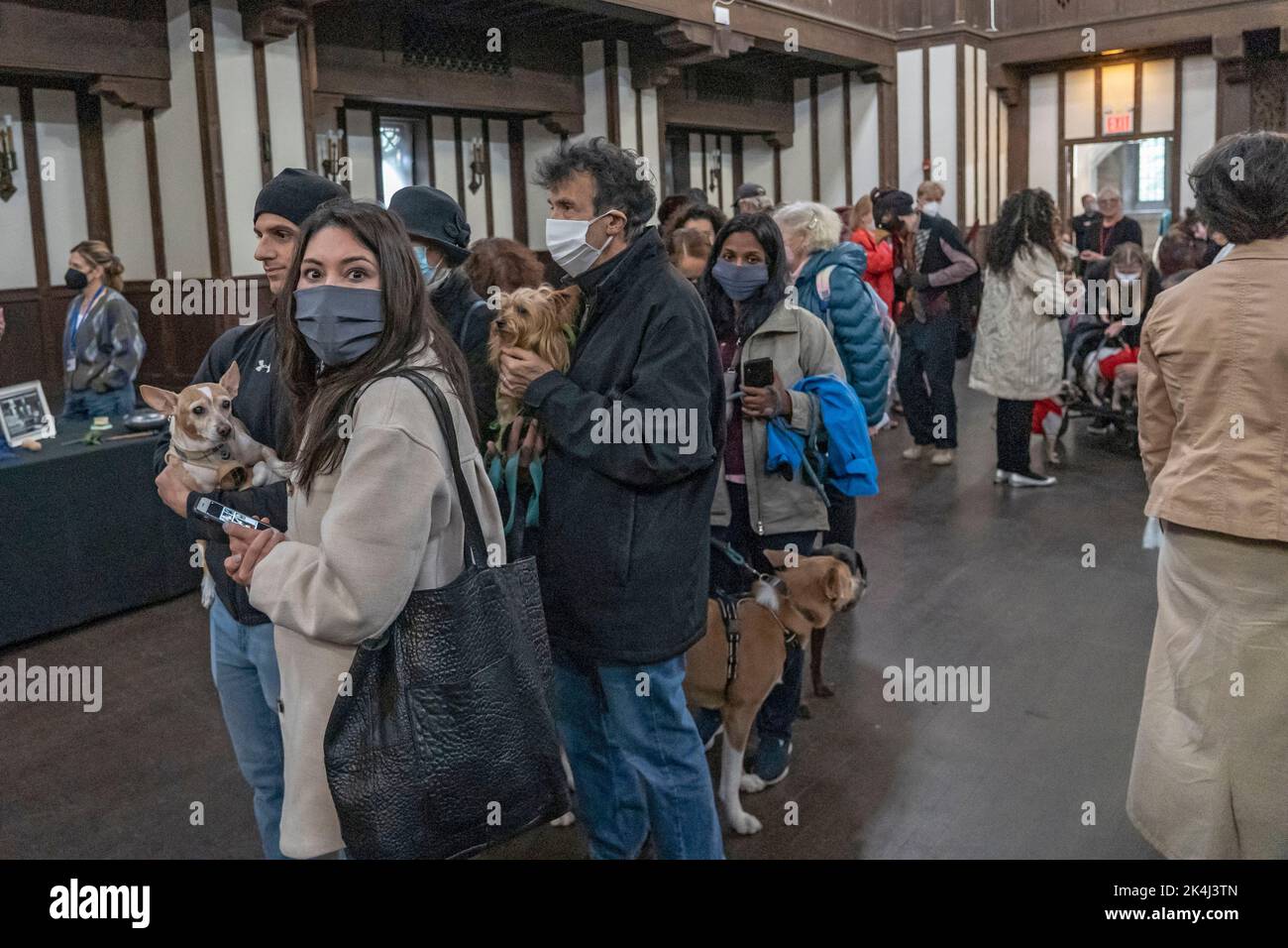 NEW YORK, NY - OCTOBER 02: People and their pets stand in queue for the ...