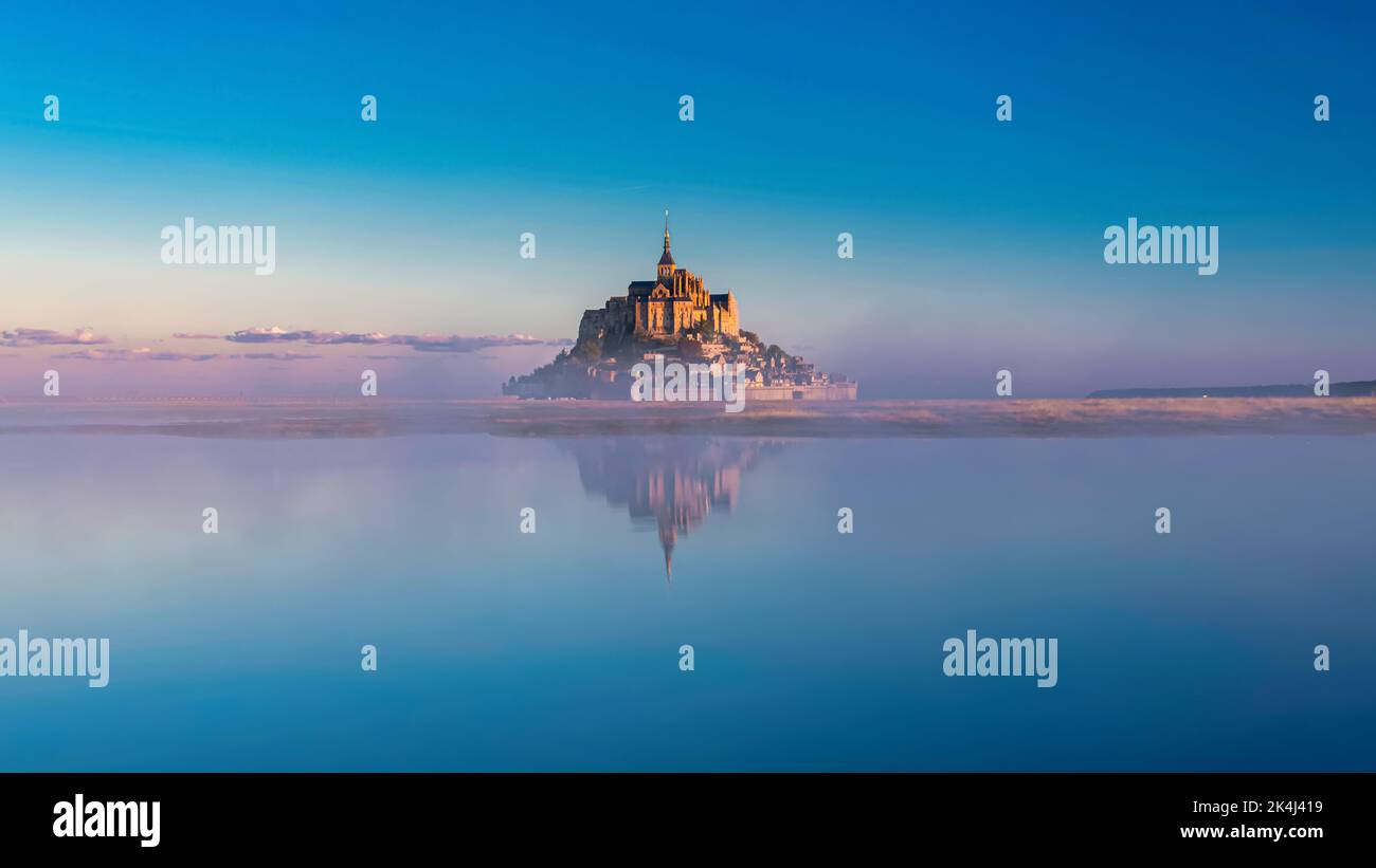 Breathtaking sunrise at the famous Le Mont Saint-Michel tidal island ...
