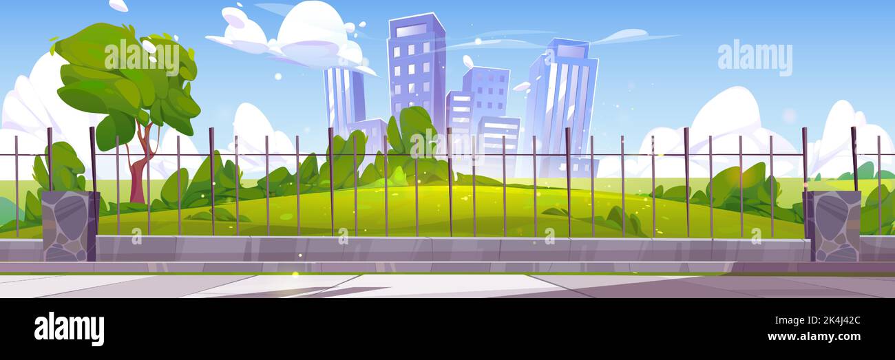 City park and buildings behind metal fence. Summer landscape with ...