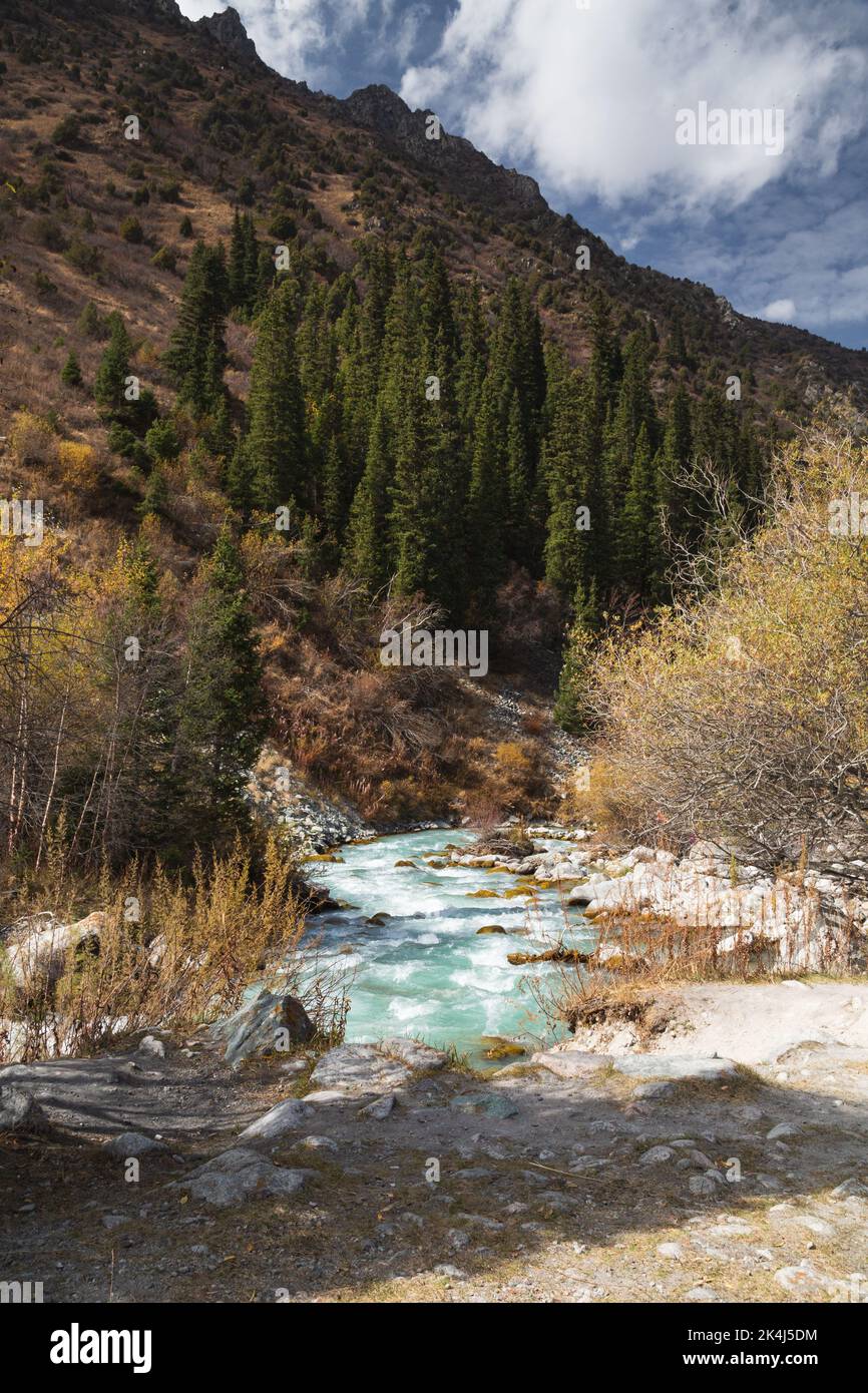 Glacial river flows through the Ala Archa mountain pass Stock Photo - Alamy