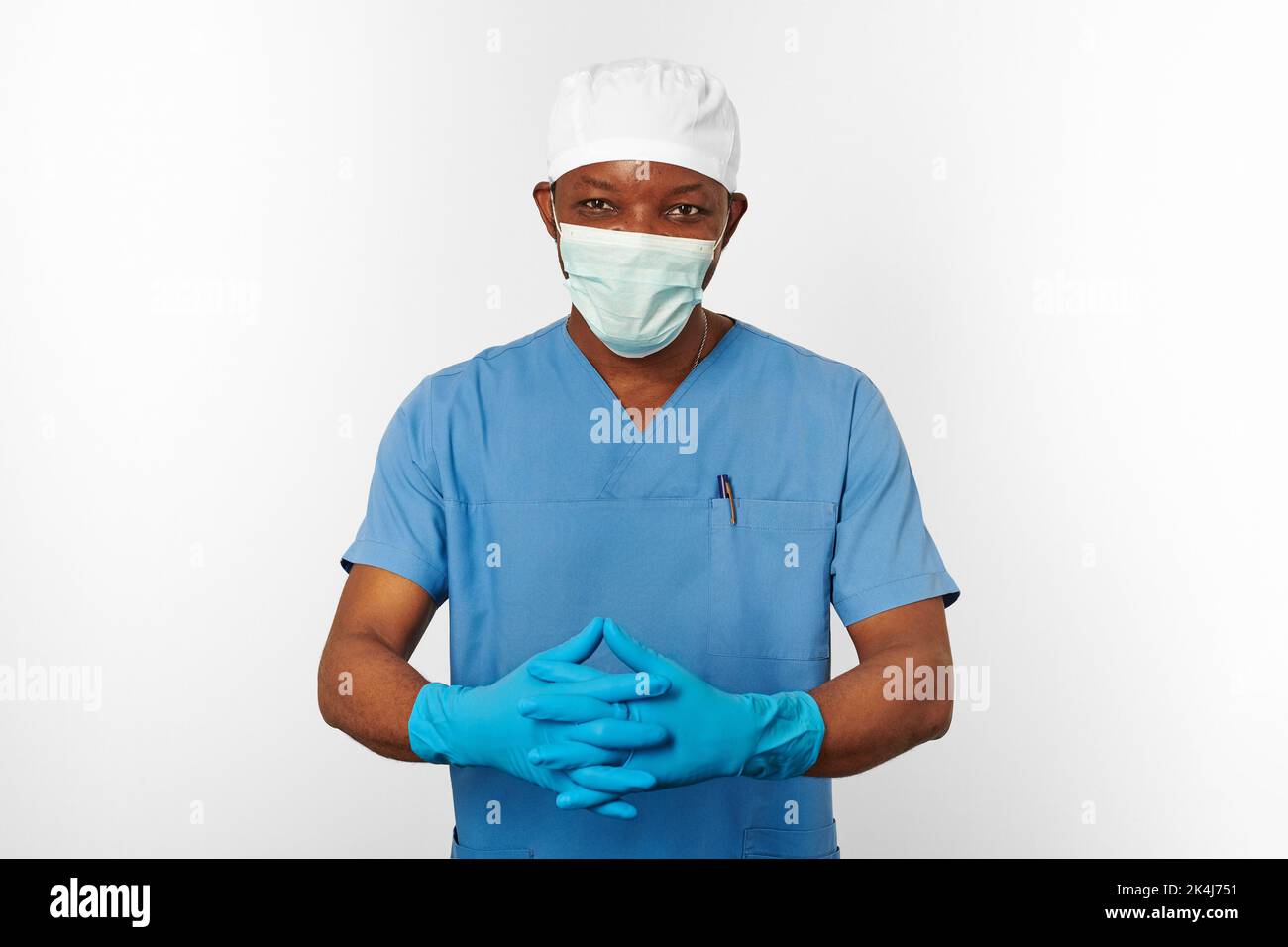 Black surgeon doctor man in blue coat white cap surgeon mask and ...