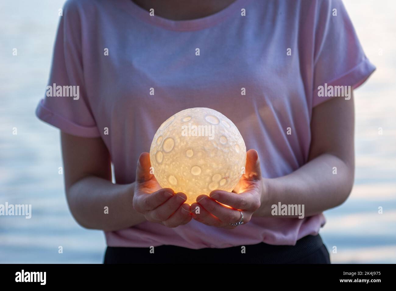 Close up moon in woman's hands. Astrology concept Stock Photo - Alamy