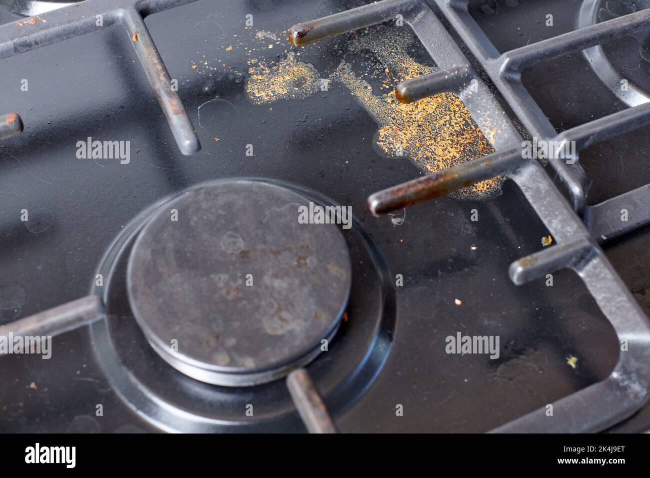 Unclean dirty kitchen black stove after soup boil over, dried food ...