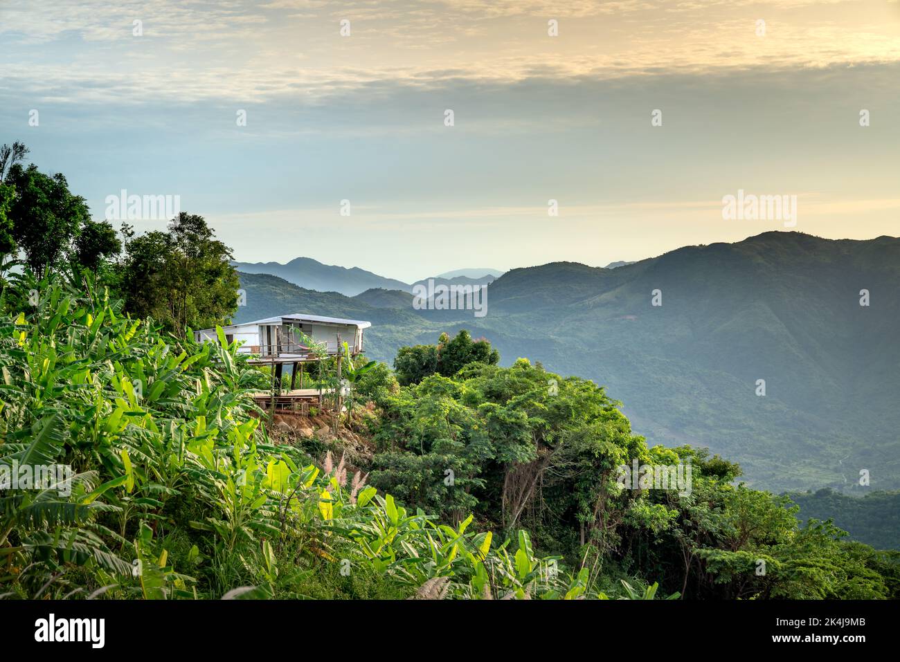 Simple little house with wooden balcony overlooking the valley. In the ...
