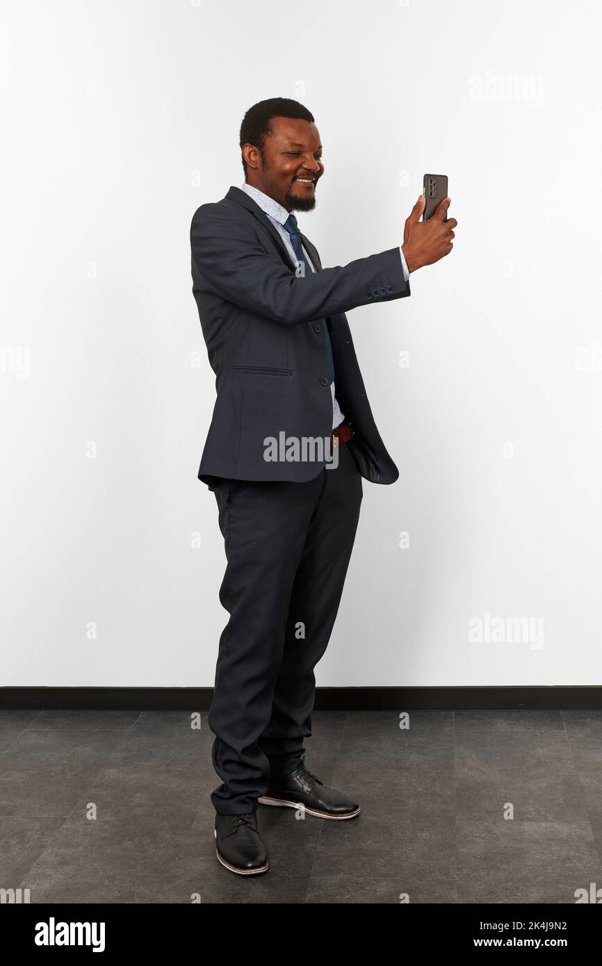 Smiling african american black man in business suit answer to video ...
