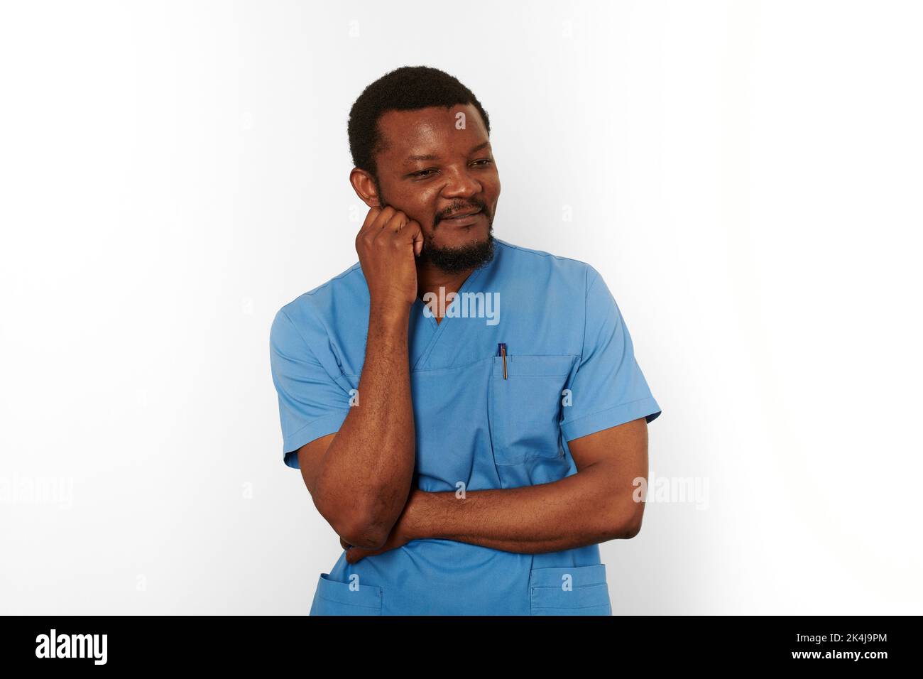 Thoughtful black surgeon doctor bearded man in blue coat isolated on ...