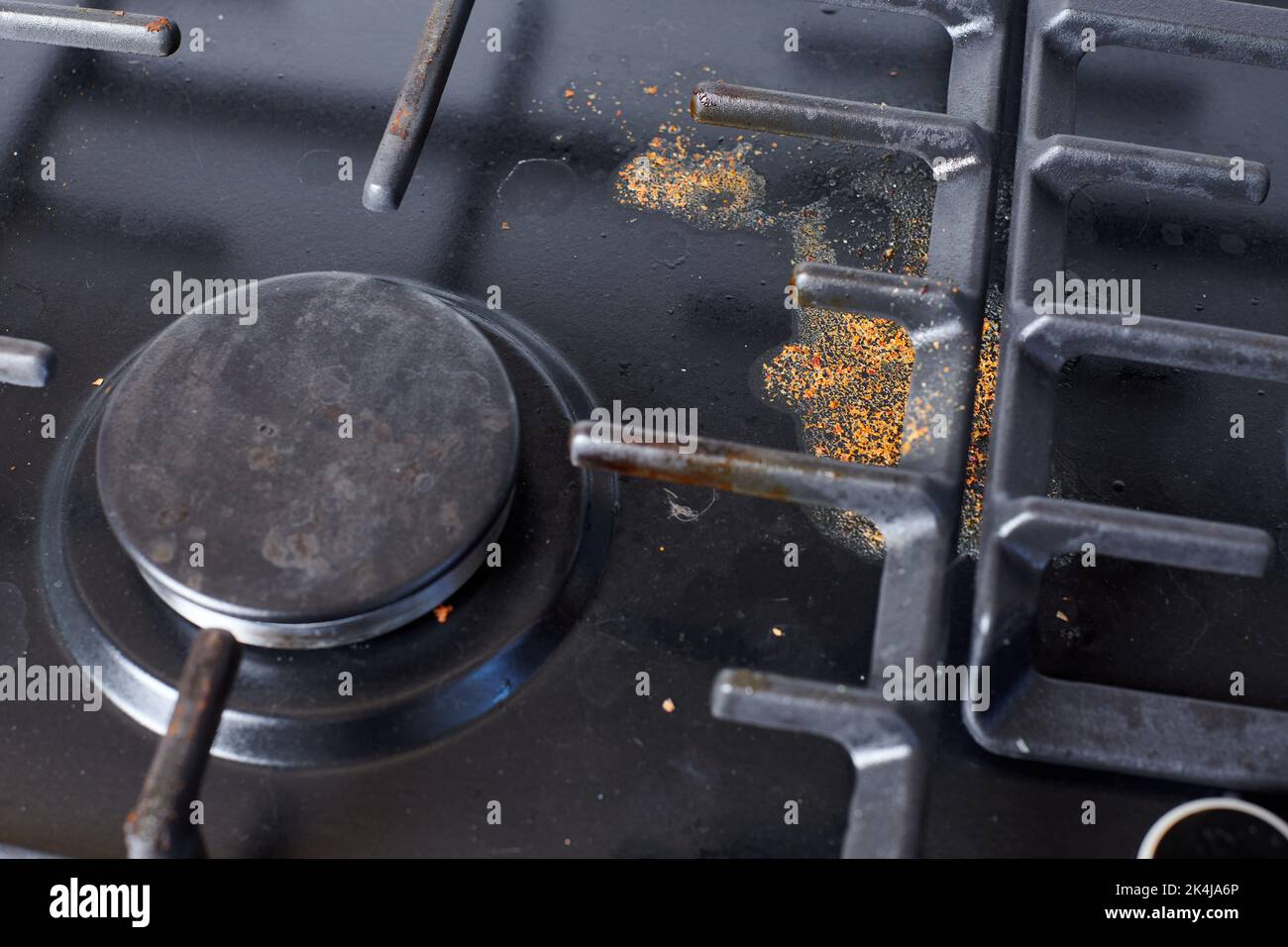 Unclean dirty kitchen black stove after soup boil over, dried food ...