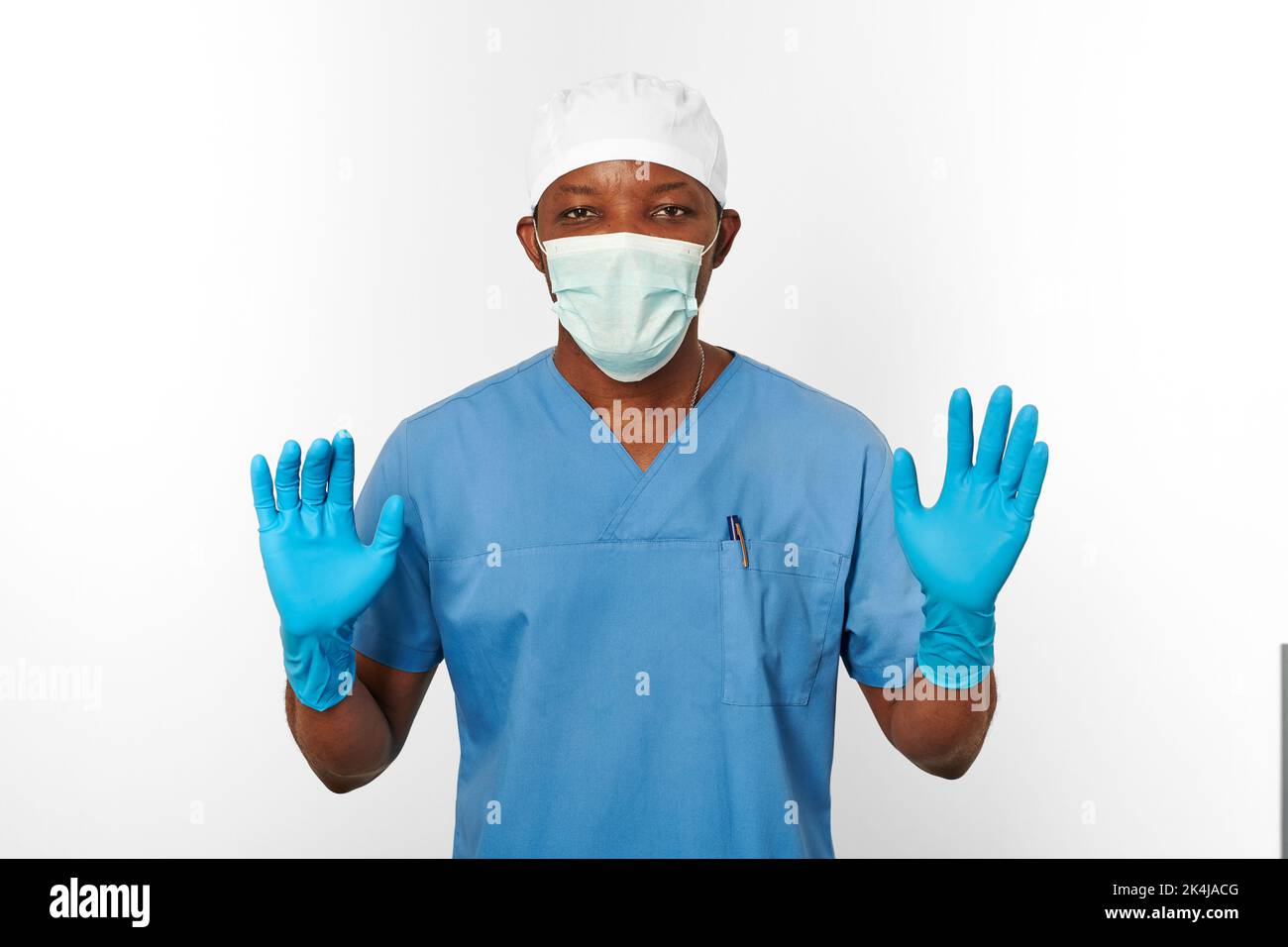 Black surgeon doctor man in blue coat white cap surgeon mask and ...