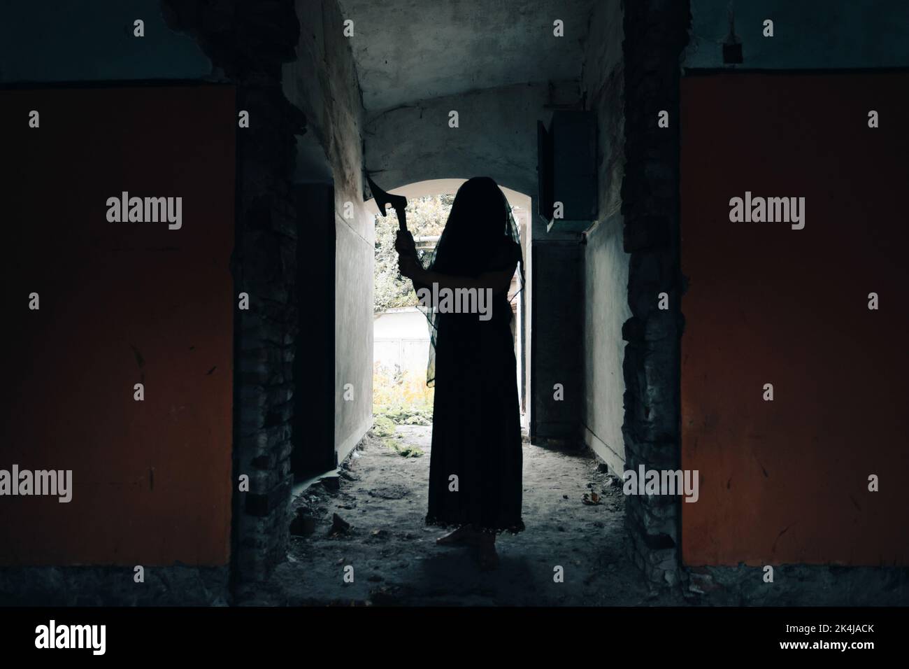 Ghost in abandoned, haunted house. Horror scene of spooky silhouette holding old axe, halloween ...