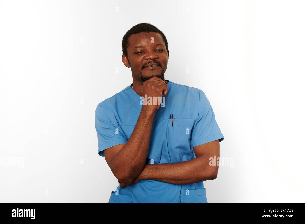 Thoughtful black surgeon doctor bearded man in blue coat isolated on ...