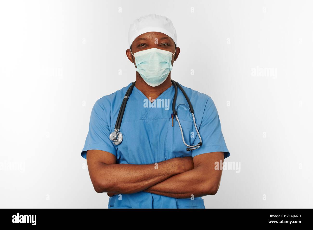 Black surgeon doctor man in blue coat white cap and surgeon mask with ...