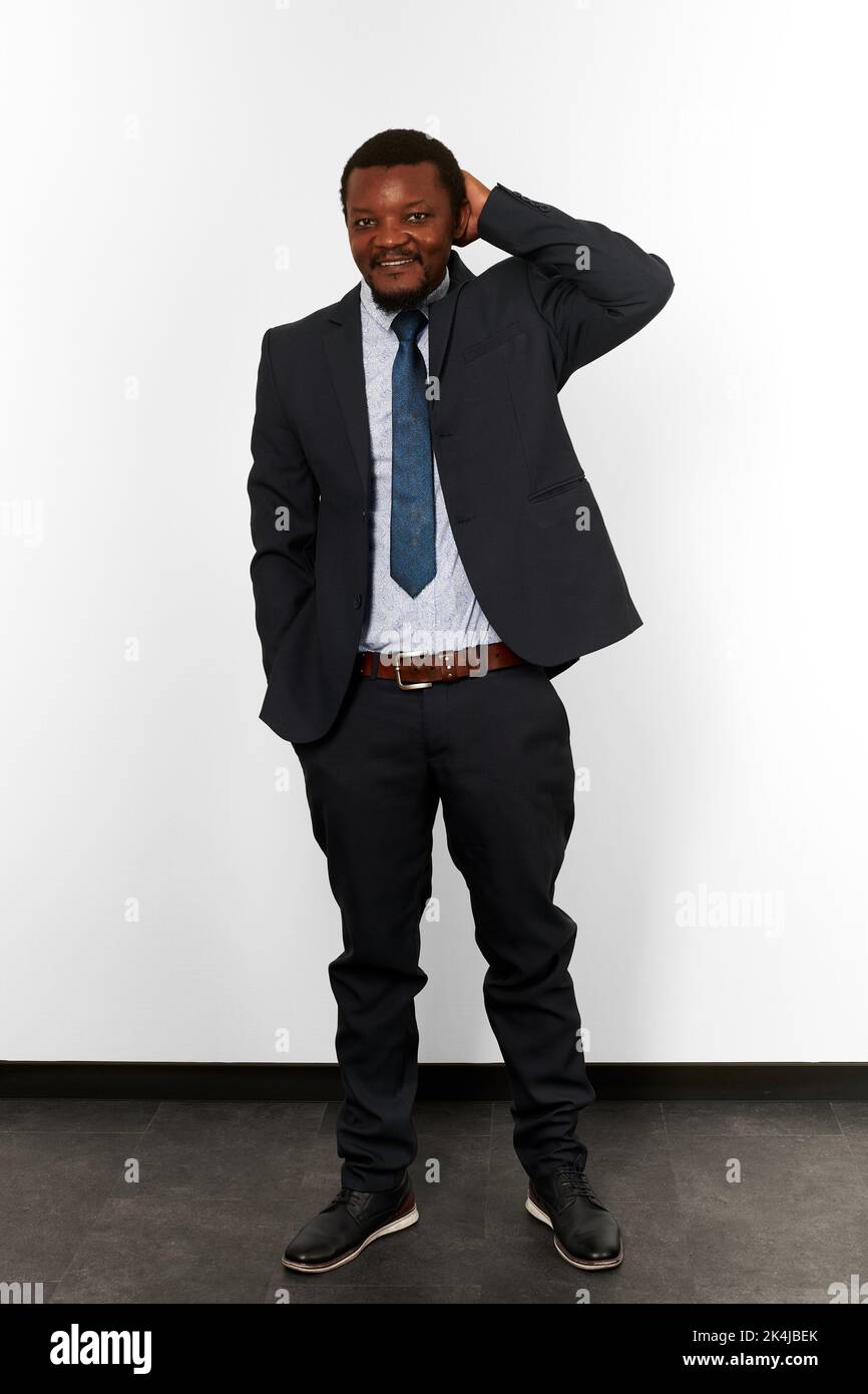 Confused smiling african american black man in business suit full size ...