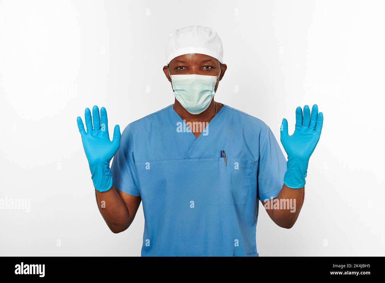 Black surgeon doctor man in blue coat white cap surgeon mask and ...