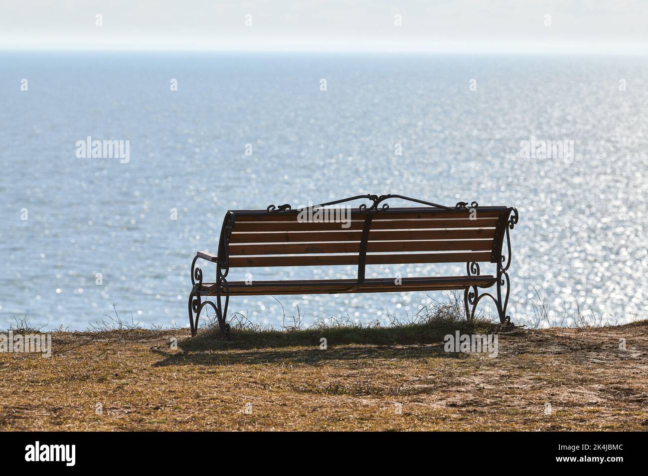 Empty bench on cliff before sea background, peaceful and quiet place ...