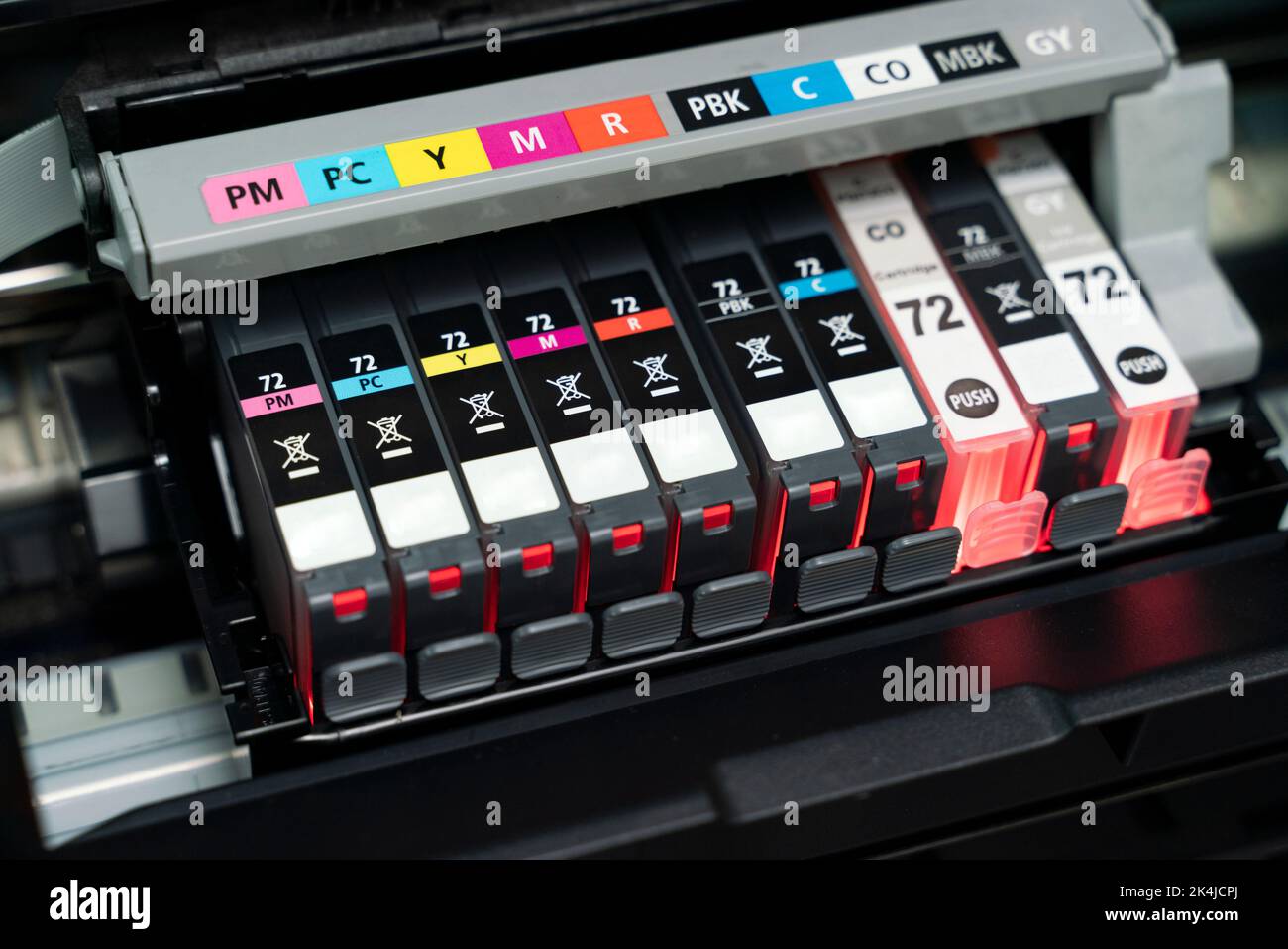 A stack of color printer cartridges Stock Photo - Alamy