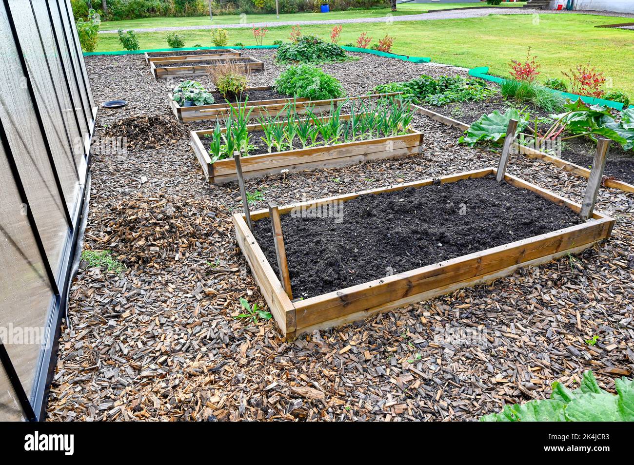 Greenhouse and cultivating boxes in private garden Stock Photo - Alamy