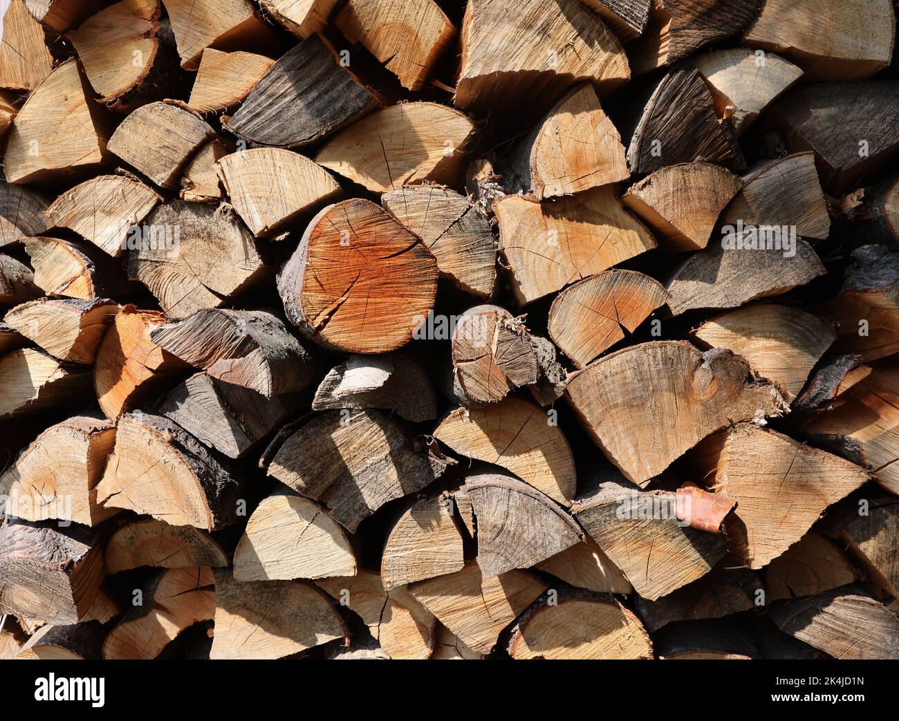 stack of firewood prepared for winter Stock Photo - Alamy