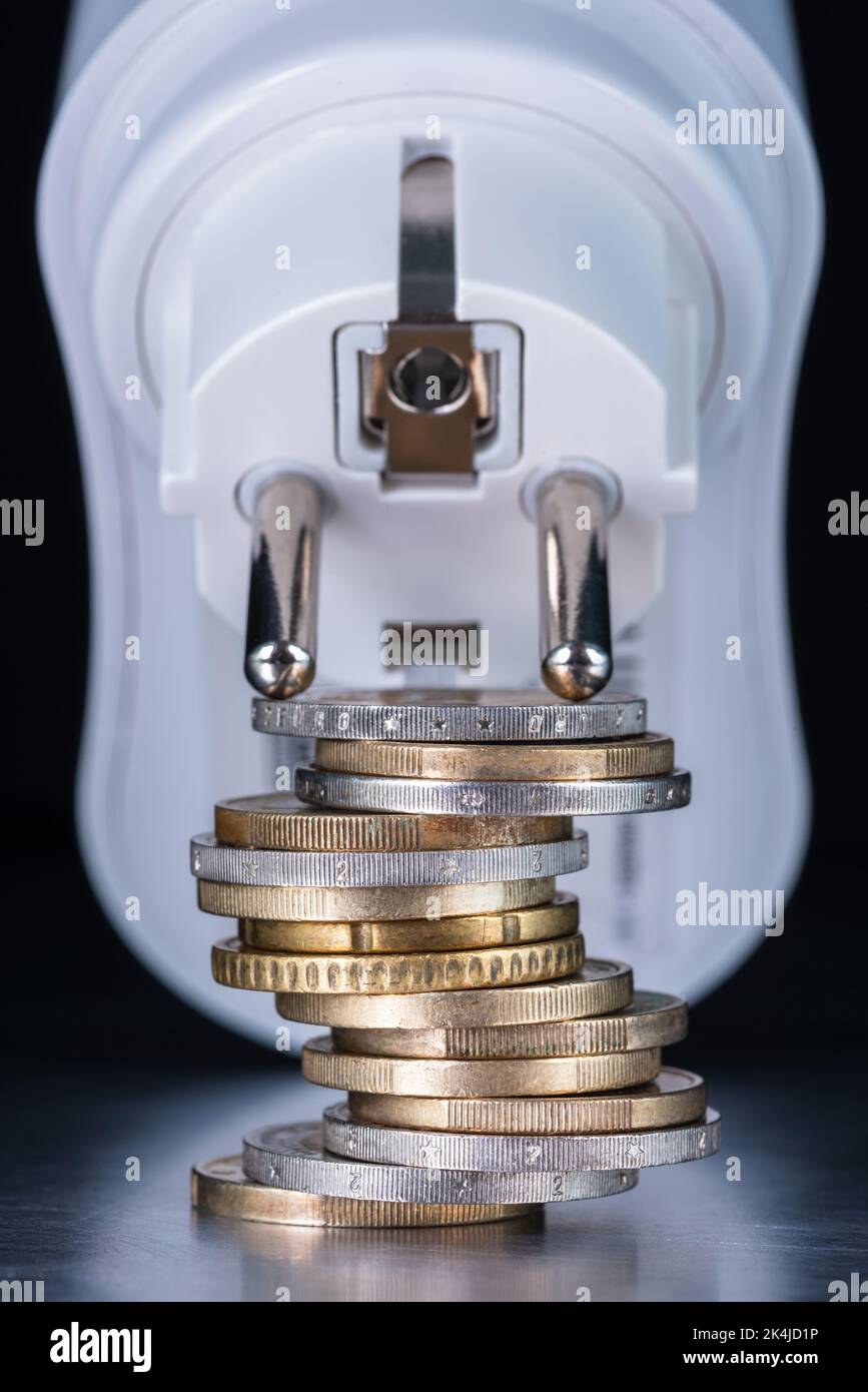 Concept of increasing electricity prices, pile of euro coins and ...