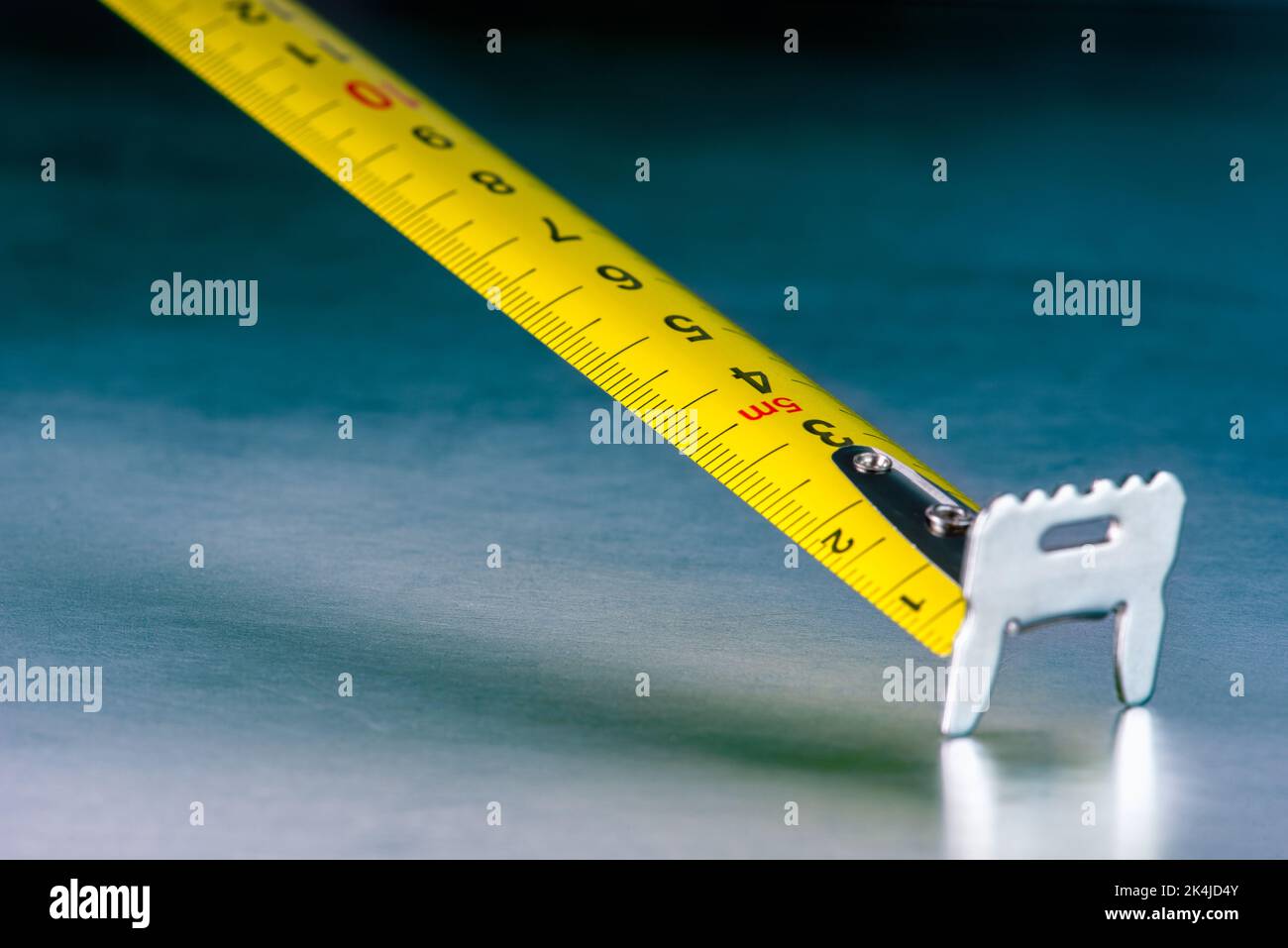 Self retracting metal tape measure hi-res stock photography and images ...