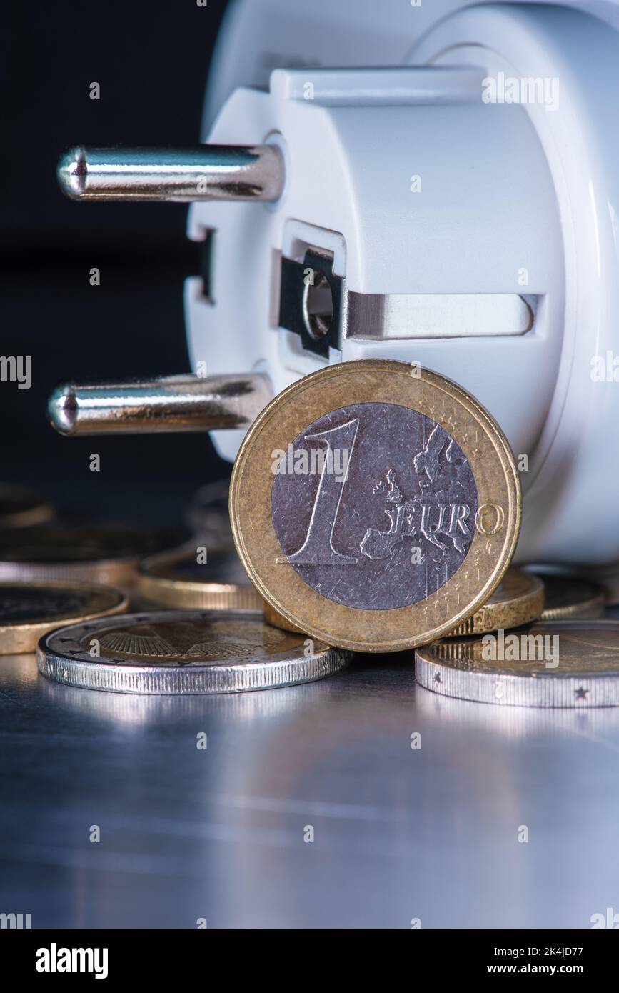 Euro coins and electrical plug, concept of inflation and increasing ...
