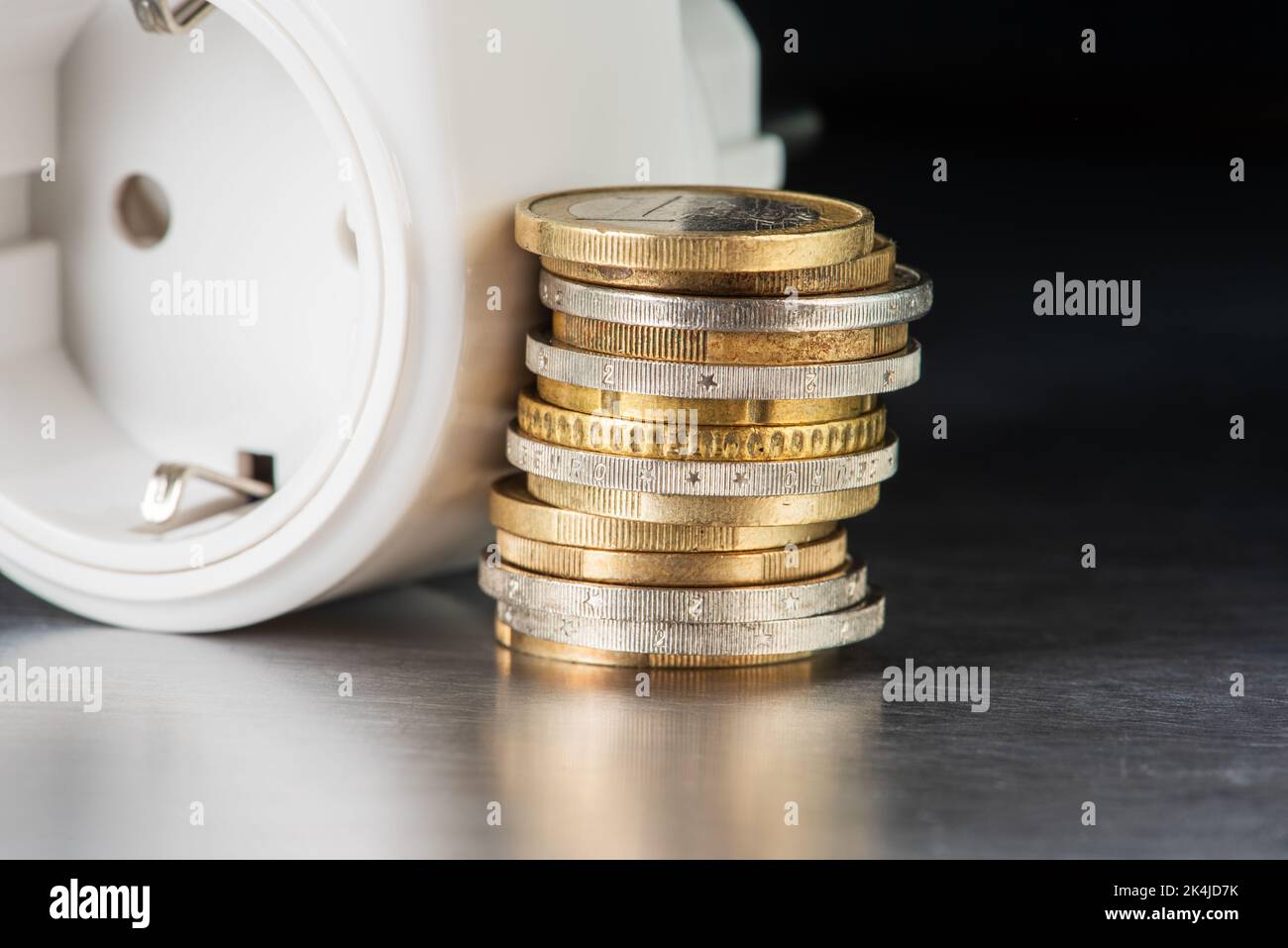 Euro coins and electrical socket, concept of inflation and increasing ...