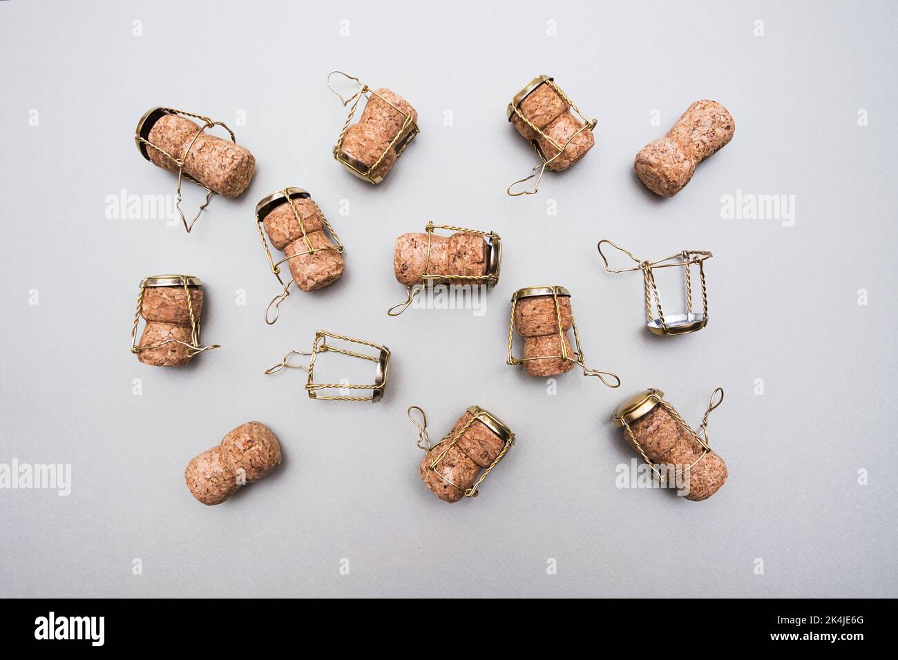 Champagne corks and metal wire muselets on grey background. Collection ...