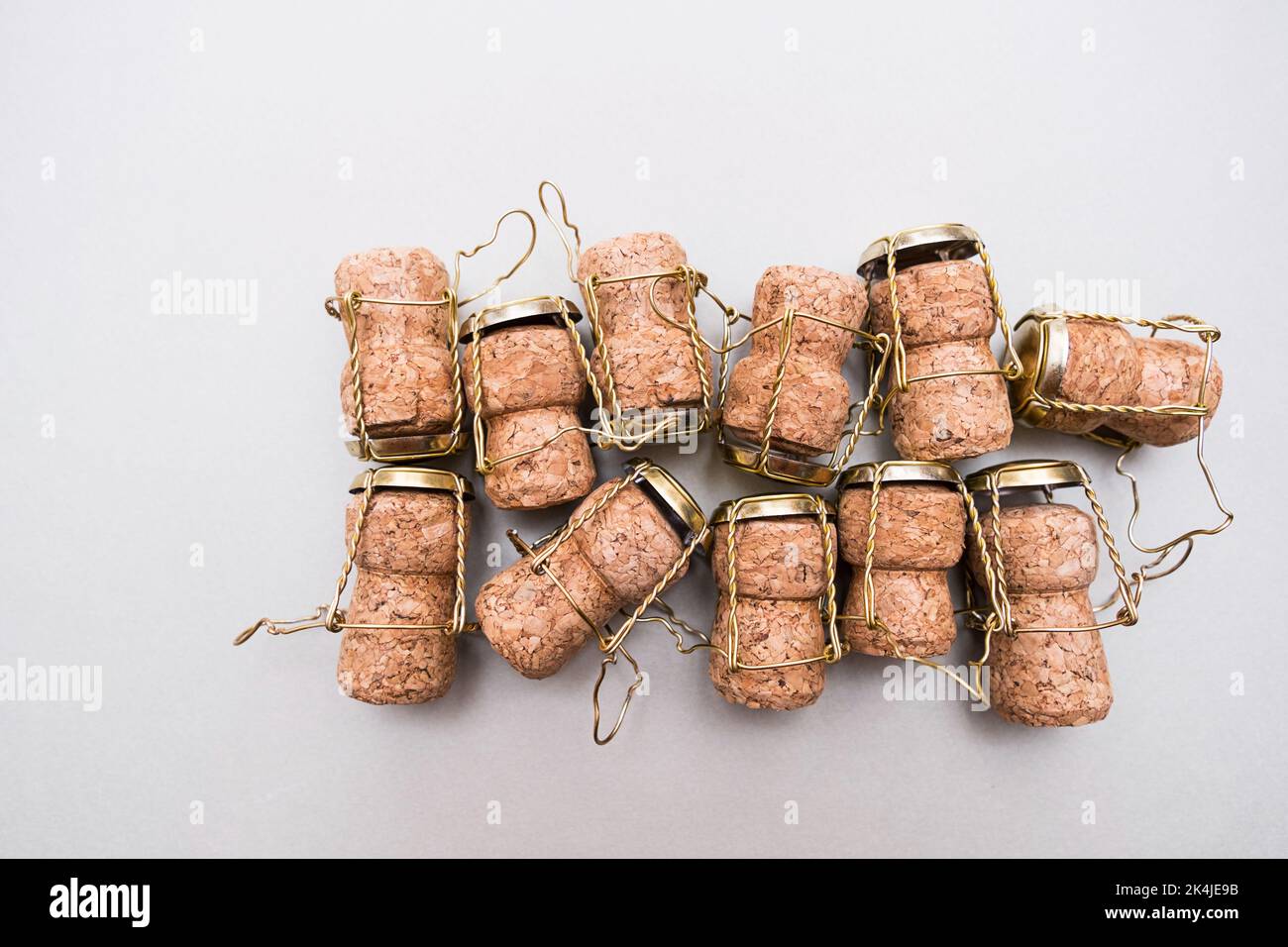 Champagne corks and metal wire muselets on grey background. Collection ...