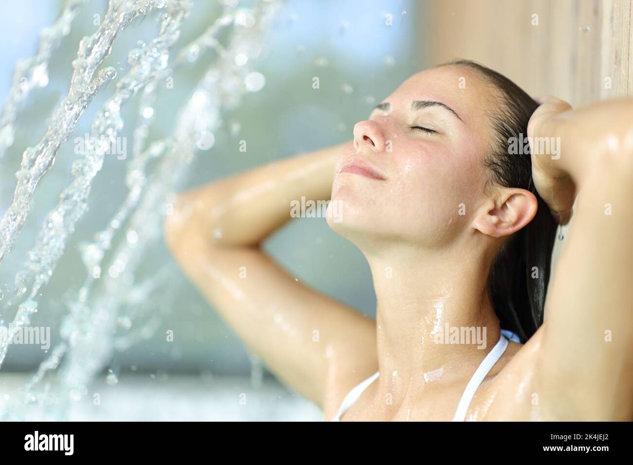 Woman bathing in waterfall hi-res stock photography and images - Alamy