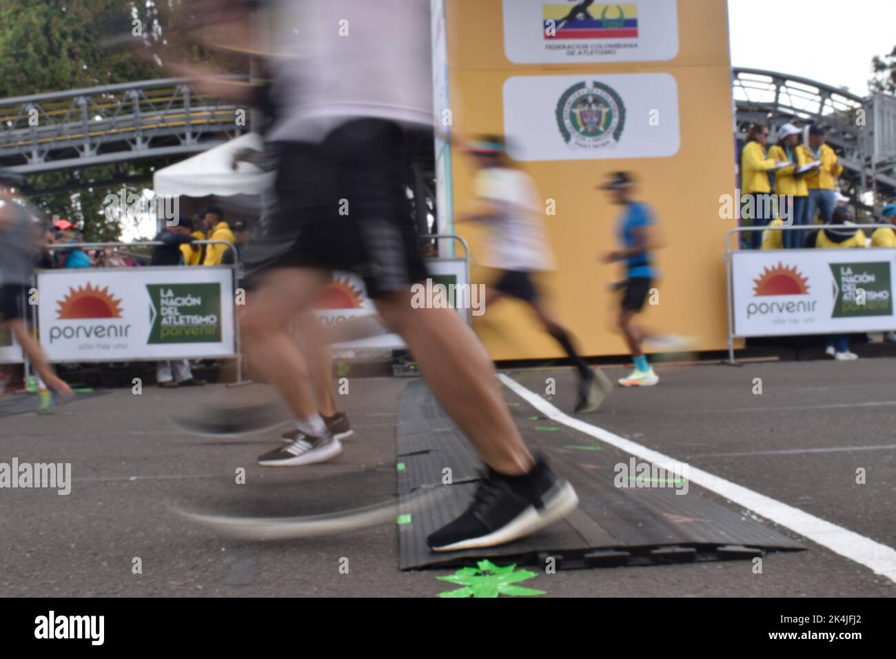 Athletes cross the finish line during the comeback after two years of ...