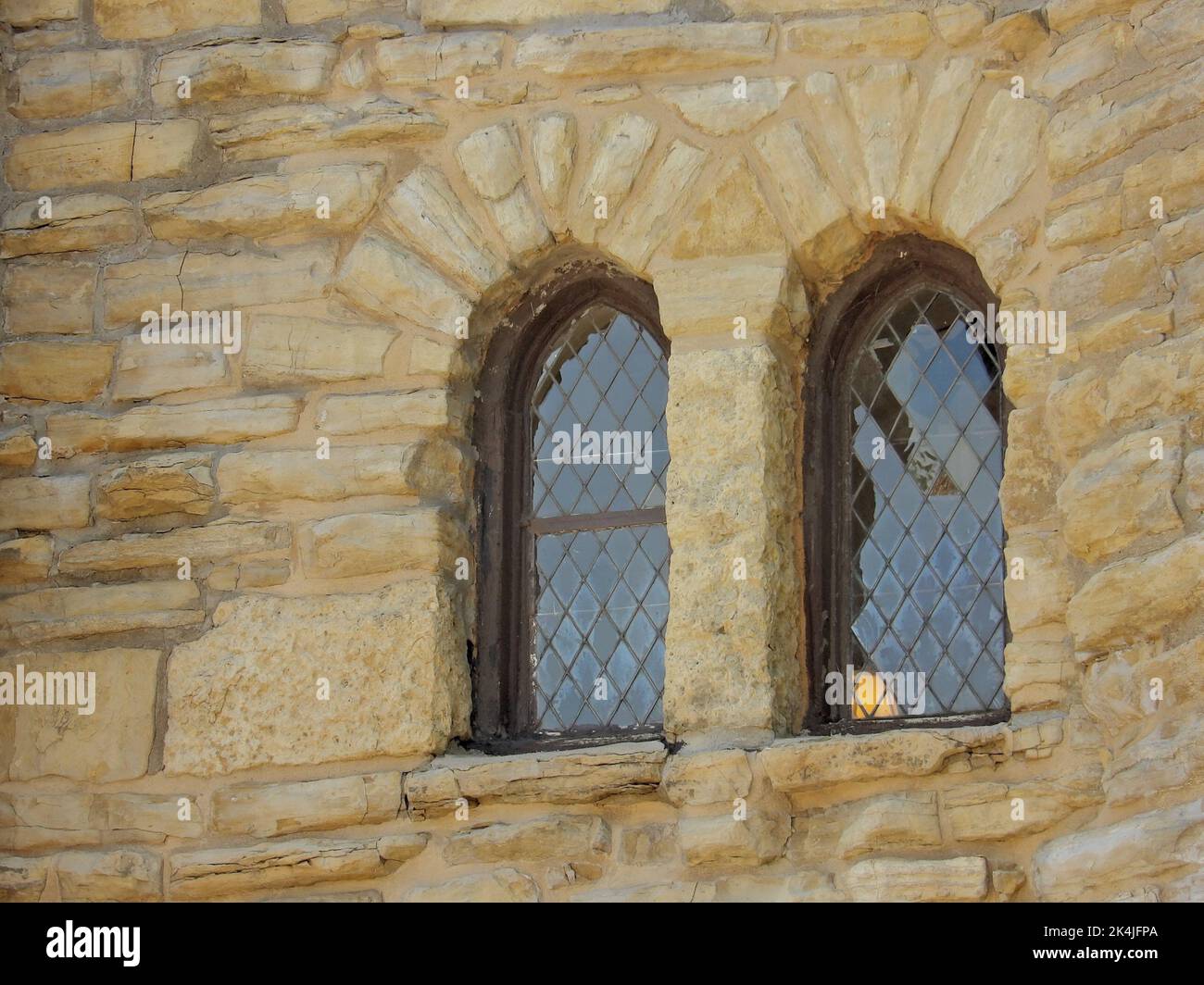 A view of arched windows on old castle wall Stock Photo - Alamy