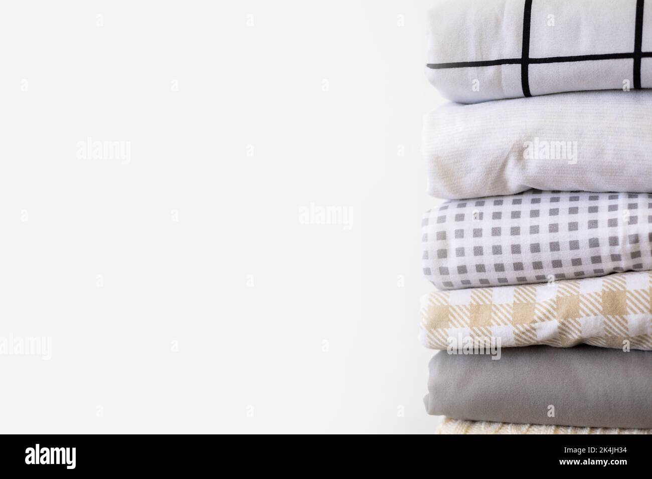 Stack bed linens and knitted warm plaids domestic soft textile with ...