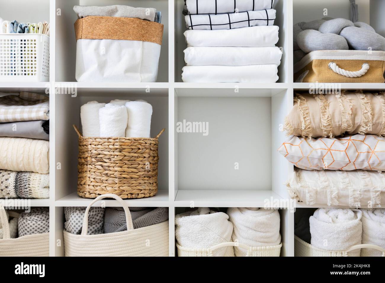 Bed linens closet neatly arrangement on shelves with copy space ...