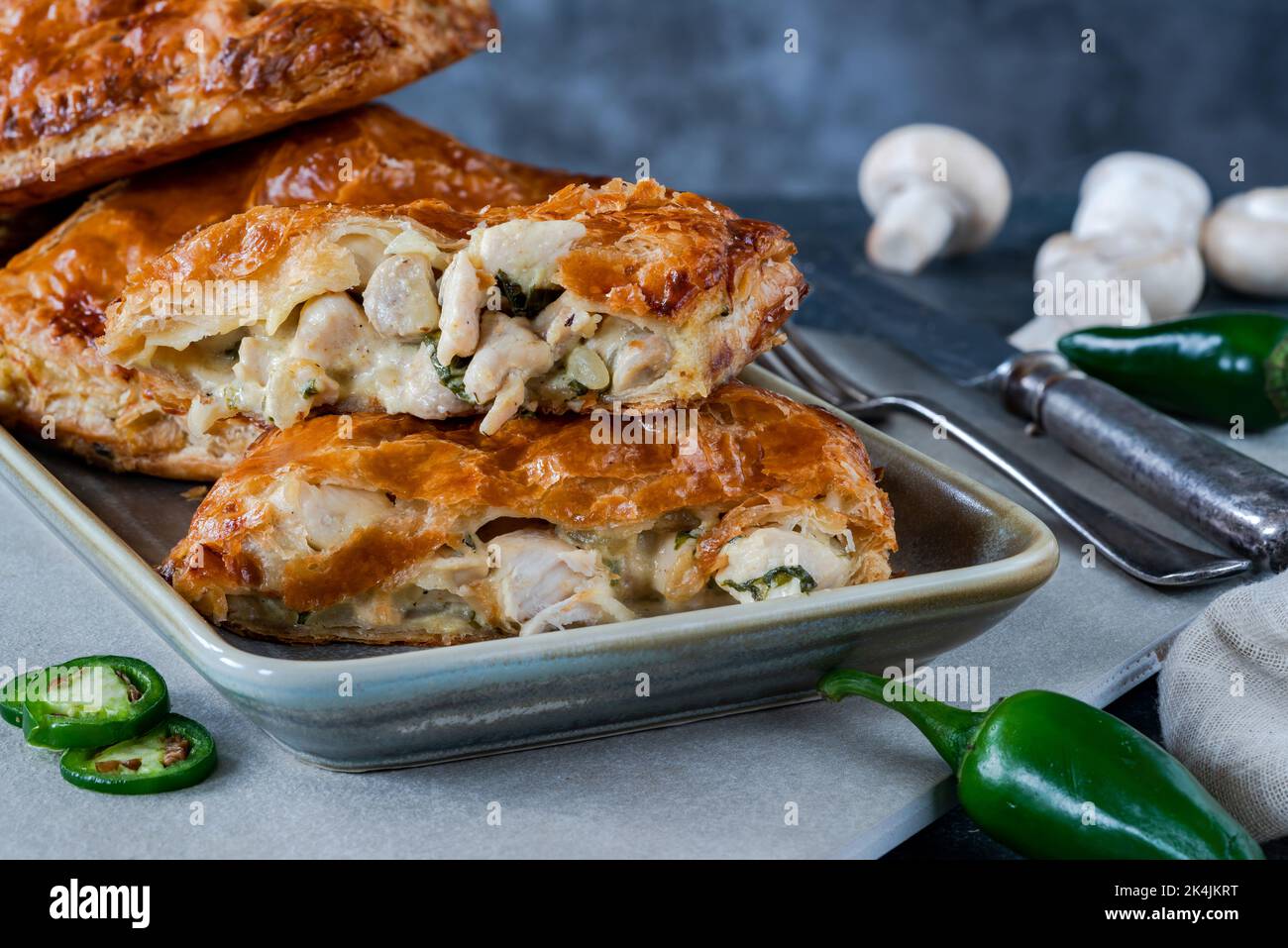 Mini chicken and mushroom puff pastry pies Stock Photo - Alamy