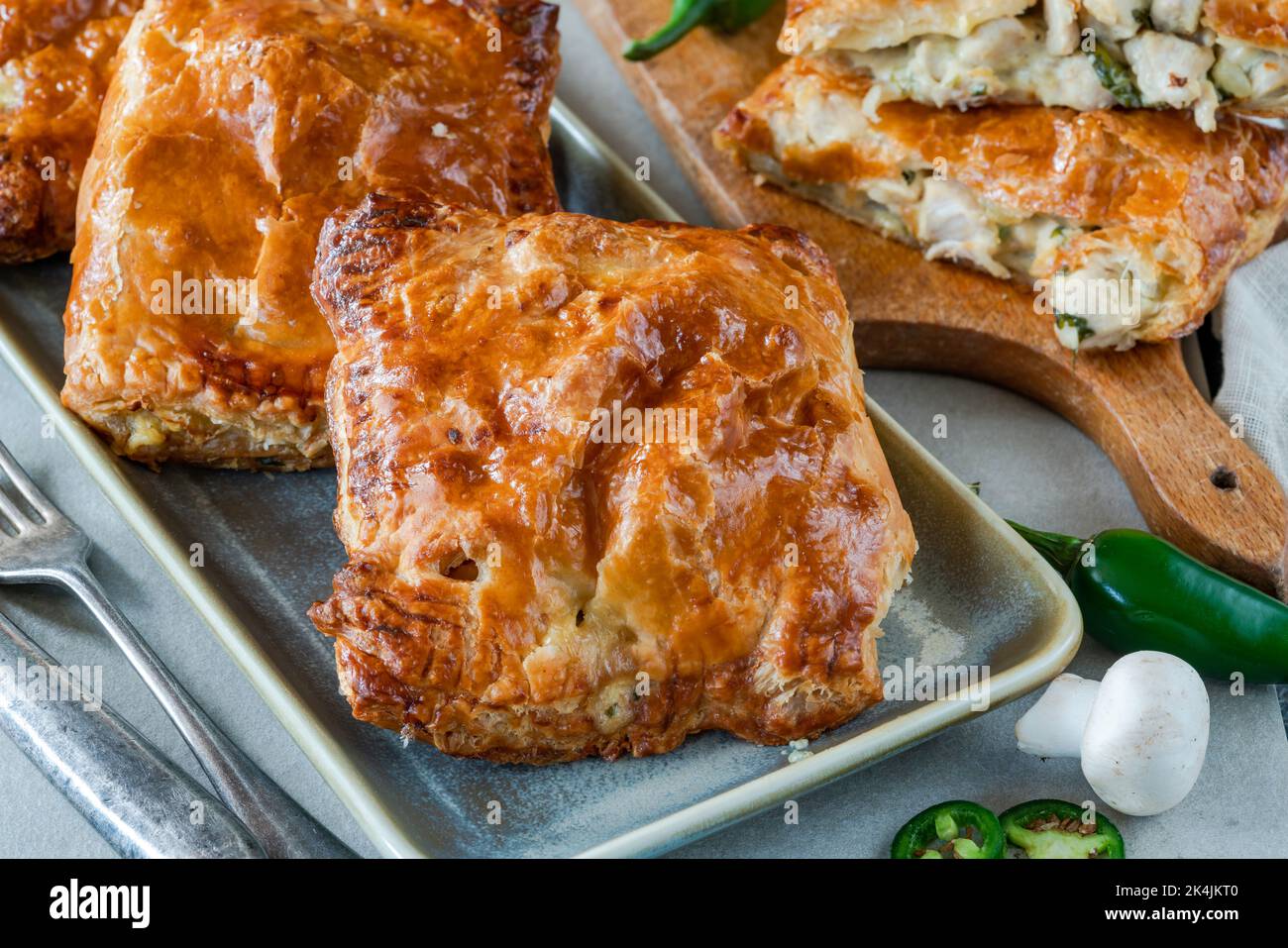 Mini chicken and mushroom puff pastry pies Stock Photo - Alamy