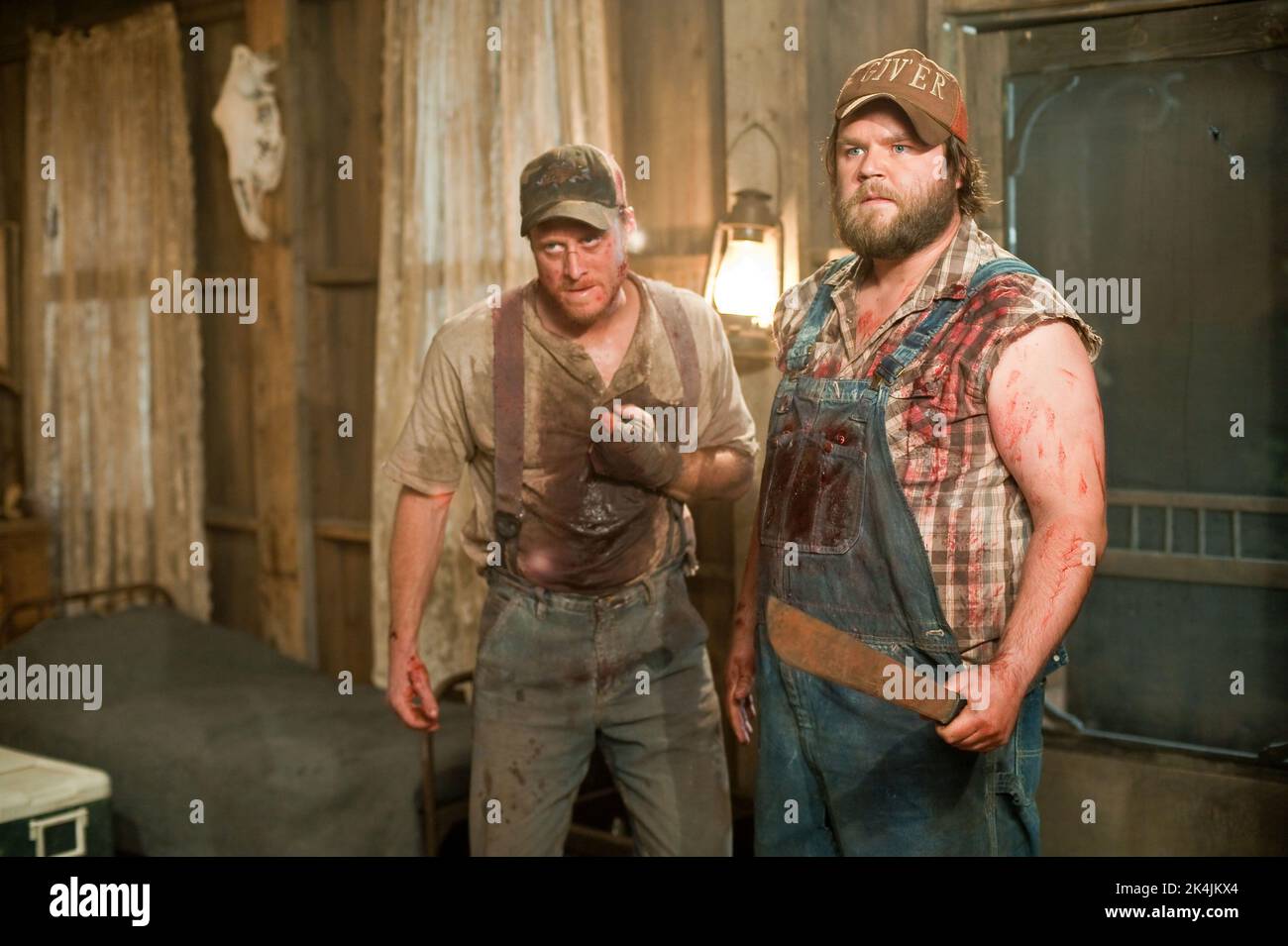 ALAN TUDYK and TYLER LABINE in TUCKER AND DALE VS EVIL (2010), directed ...