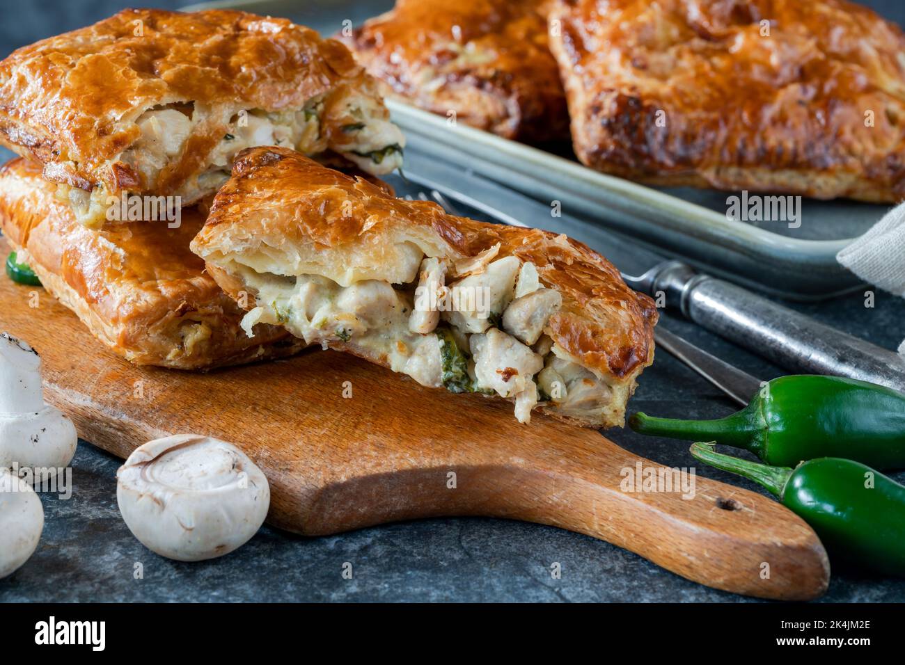 Mini chicken and mushroom puff pastry pies Stock Photo - Alamy