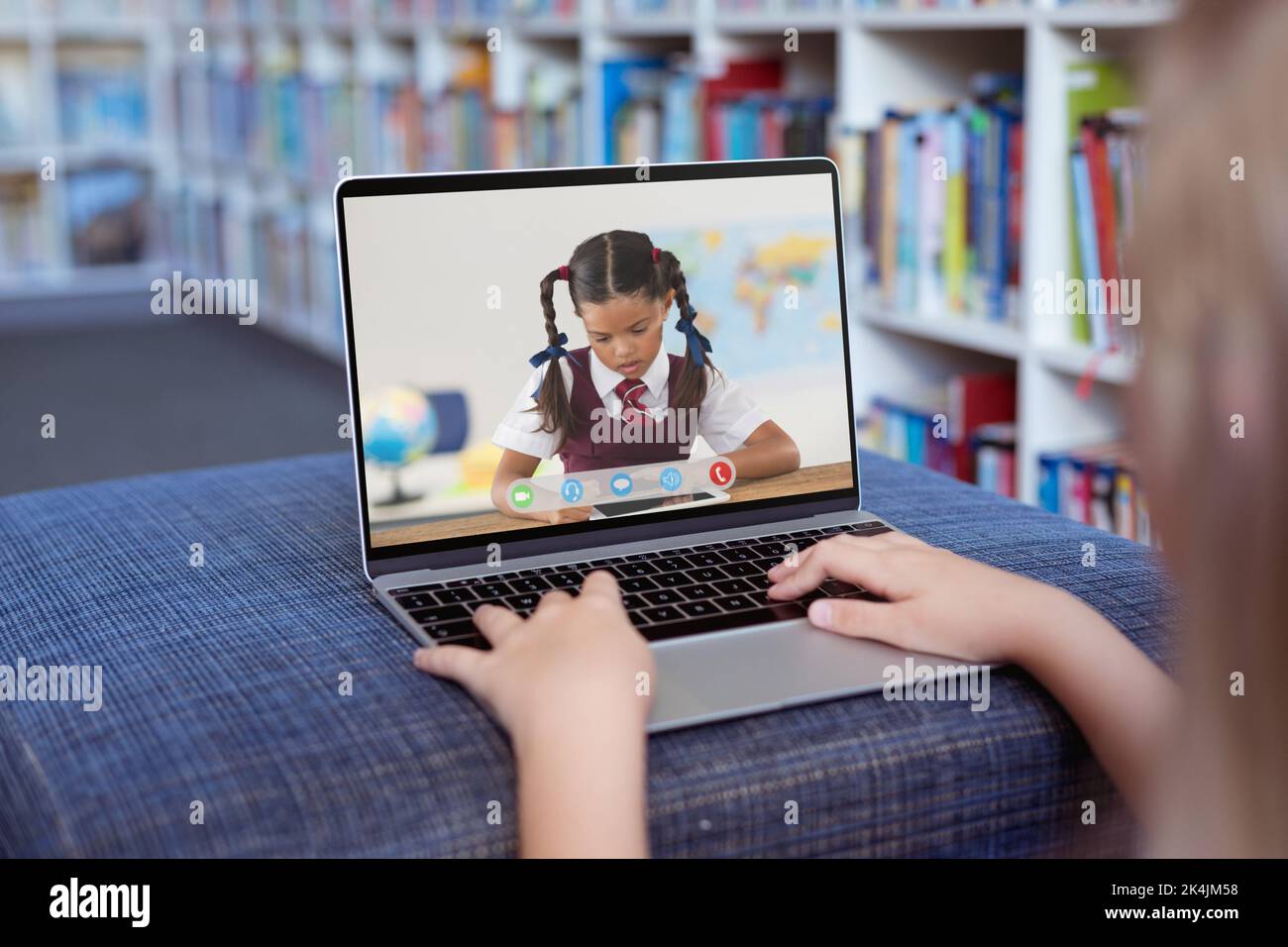 Caucasian girl using laptop for video call, with elementary school ...