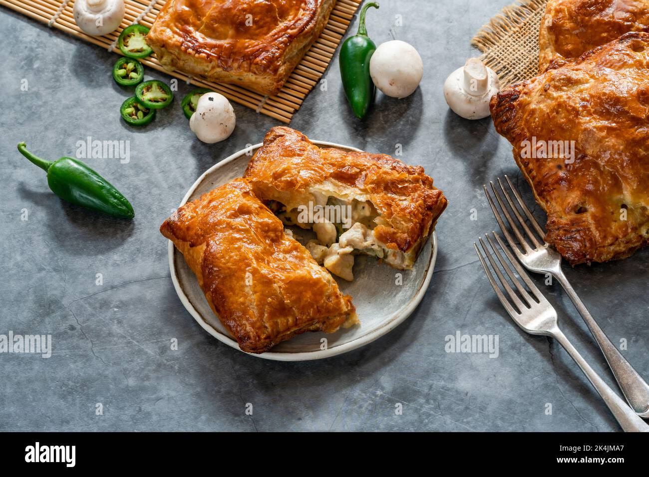 Mini chicken and mushroom puff pastry pies Stock Photo - Alamy