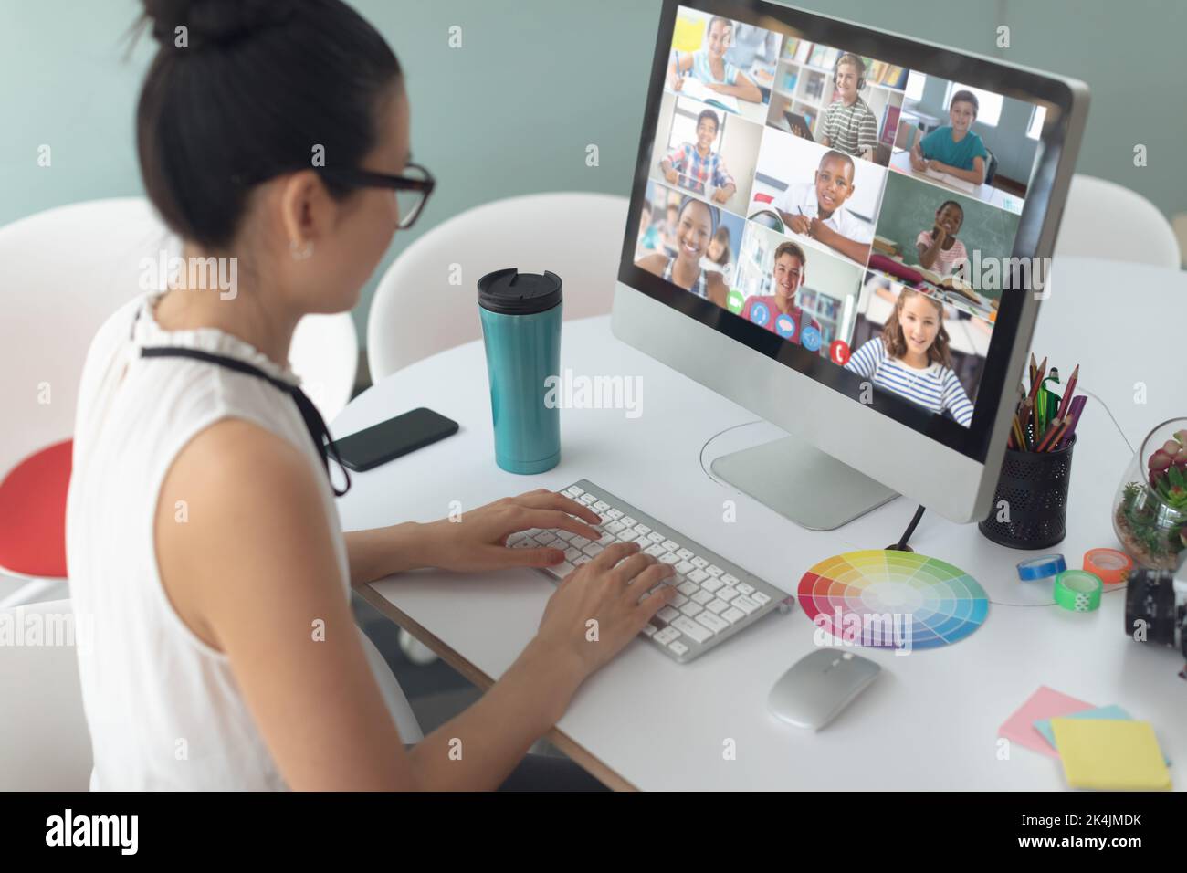 Asian girl using computer for video call, with smiling diverse ...