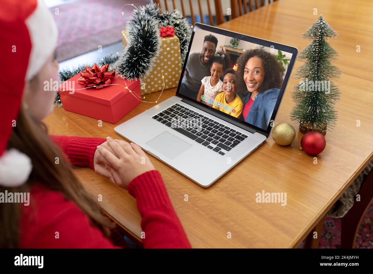 Caucasian woman in santa hat making christmas laptop video call with ...