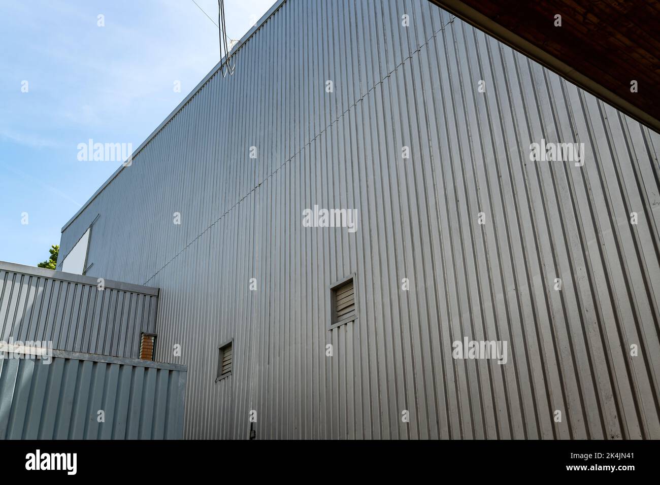 Old industrial building with metallic facade, architecture and ...