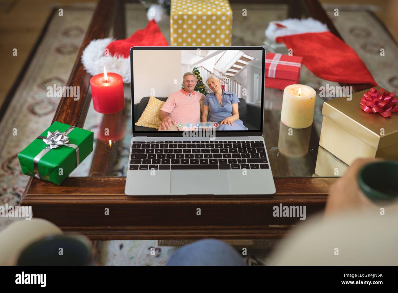 Smiling caucasian senior couple on laptop video call interface screen ...