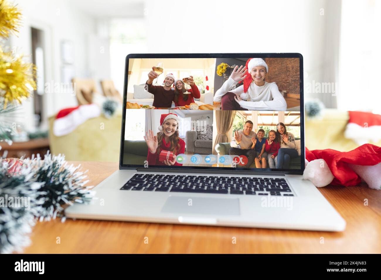 Happy caucasian family members waving and raising glasses on laptop ...