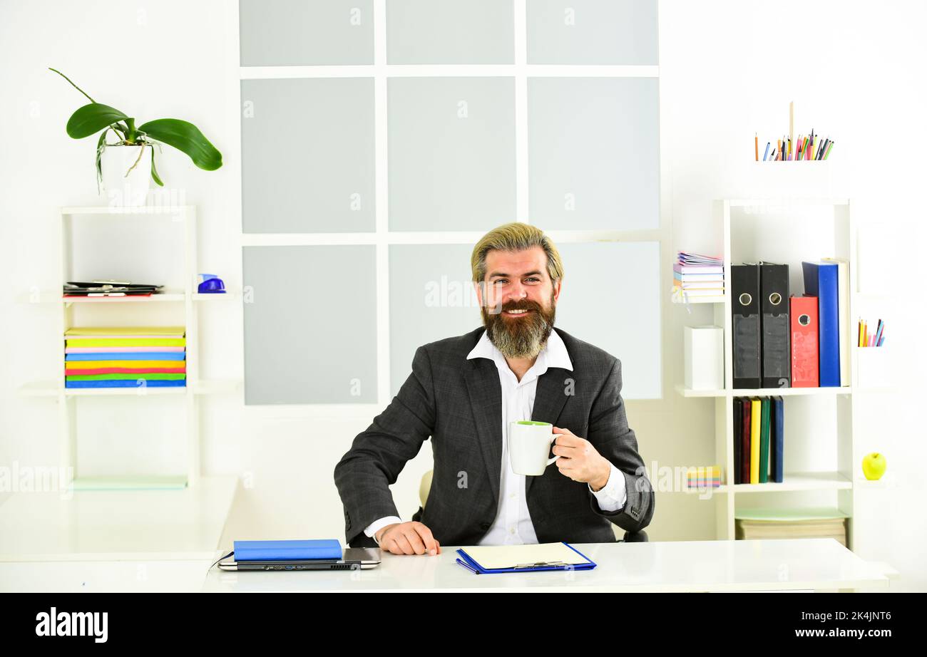 Good coffee. Respectable ceo. Man handsome boss sit in office drinking ...